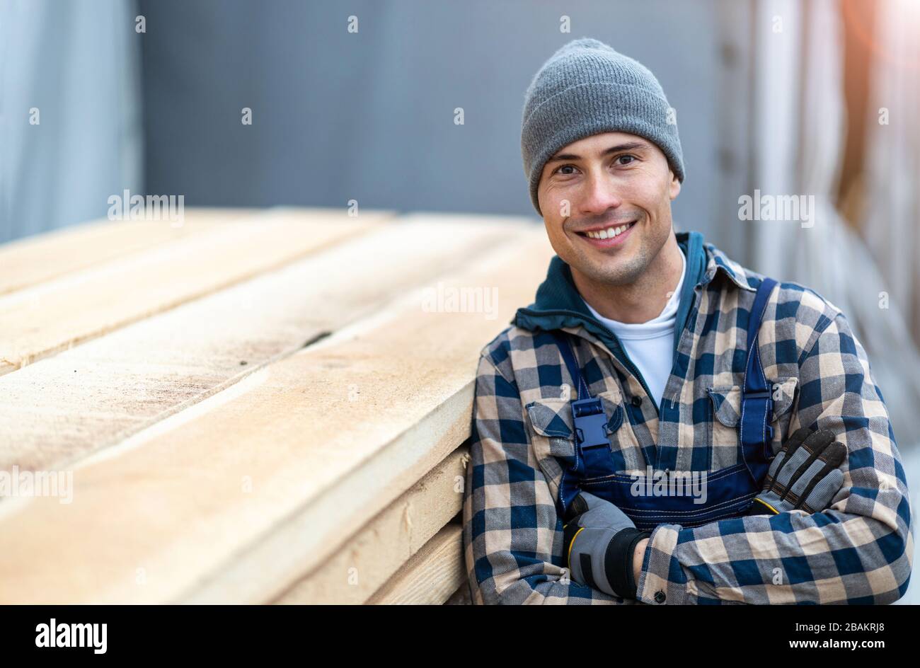 Young male worker in timber warehouse Stock Photo - Alamy