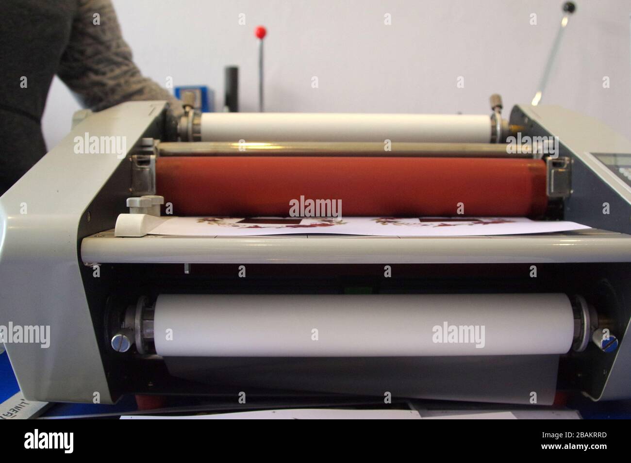 Plastic laminating machine Stock Photo - Alamy