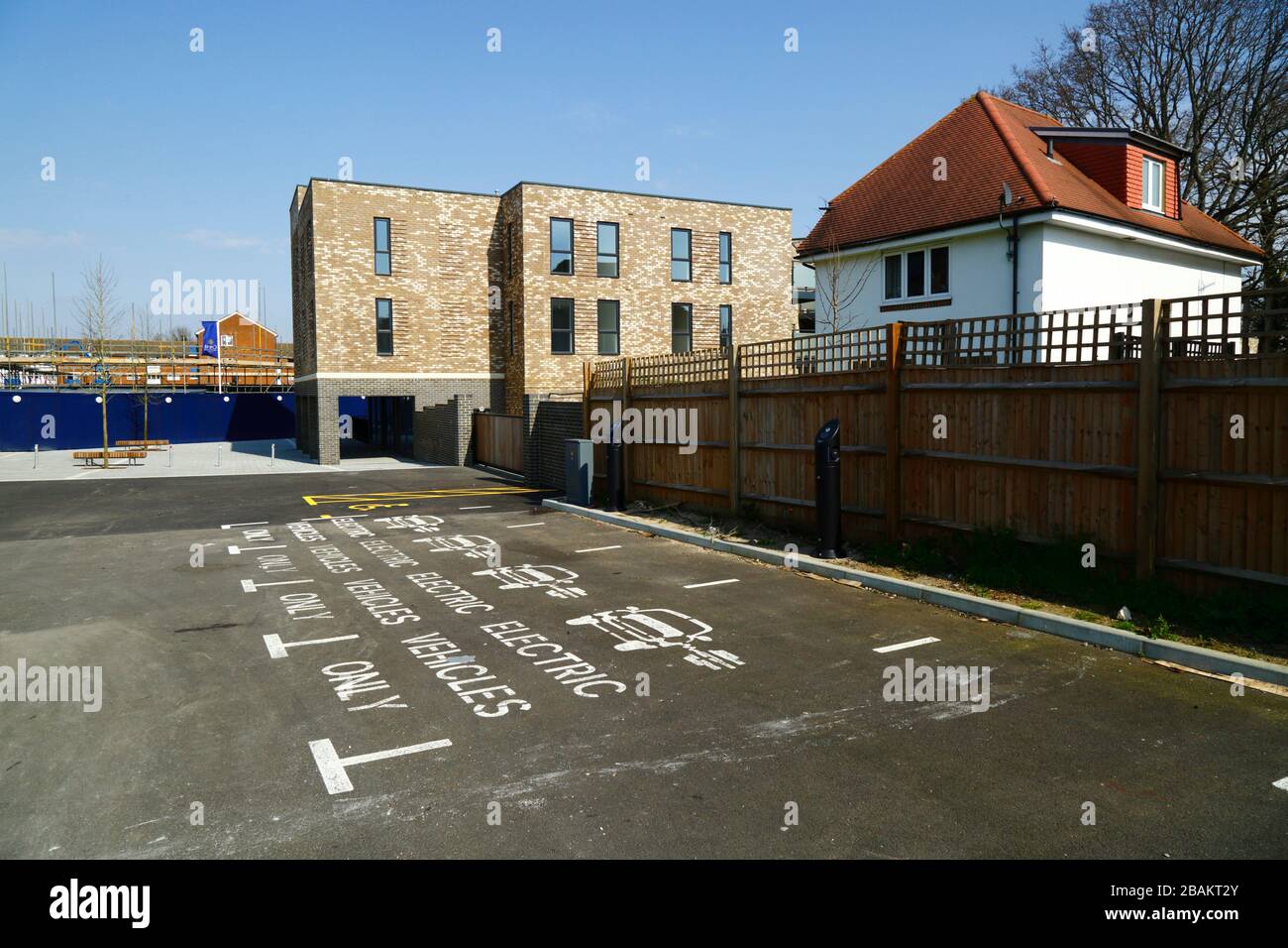 Parking spaces for electric vehicles in car park next to new ...