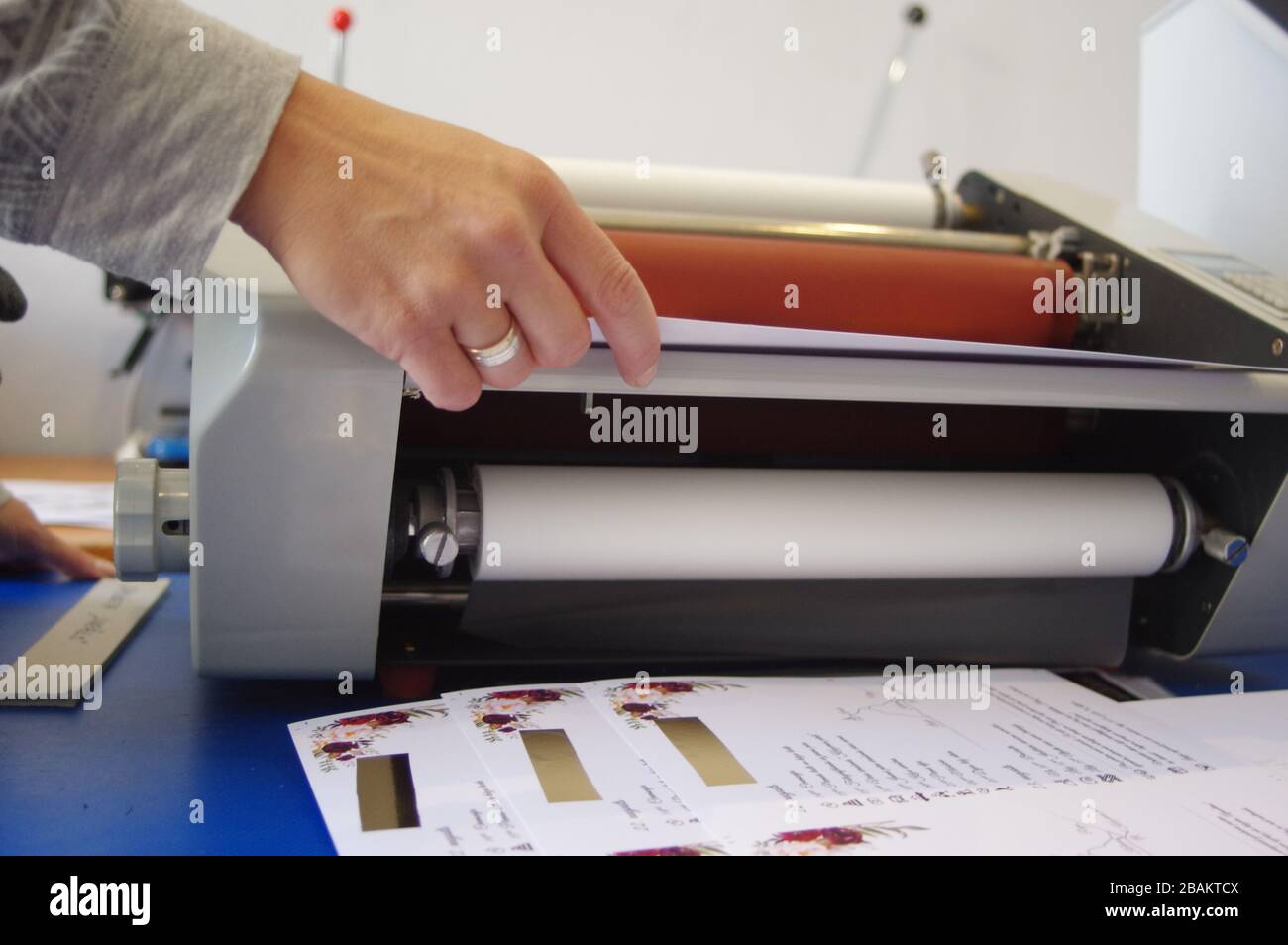 Plastic laminating machine Stock Photo - Alamy