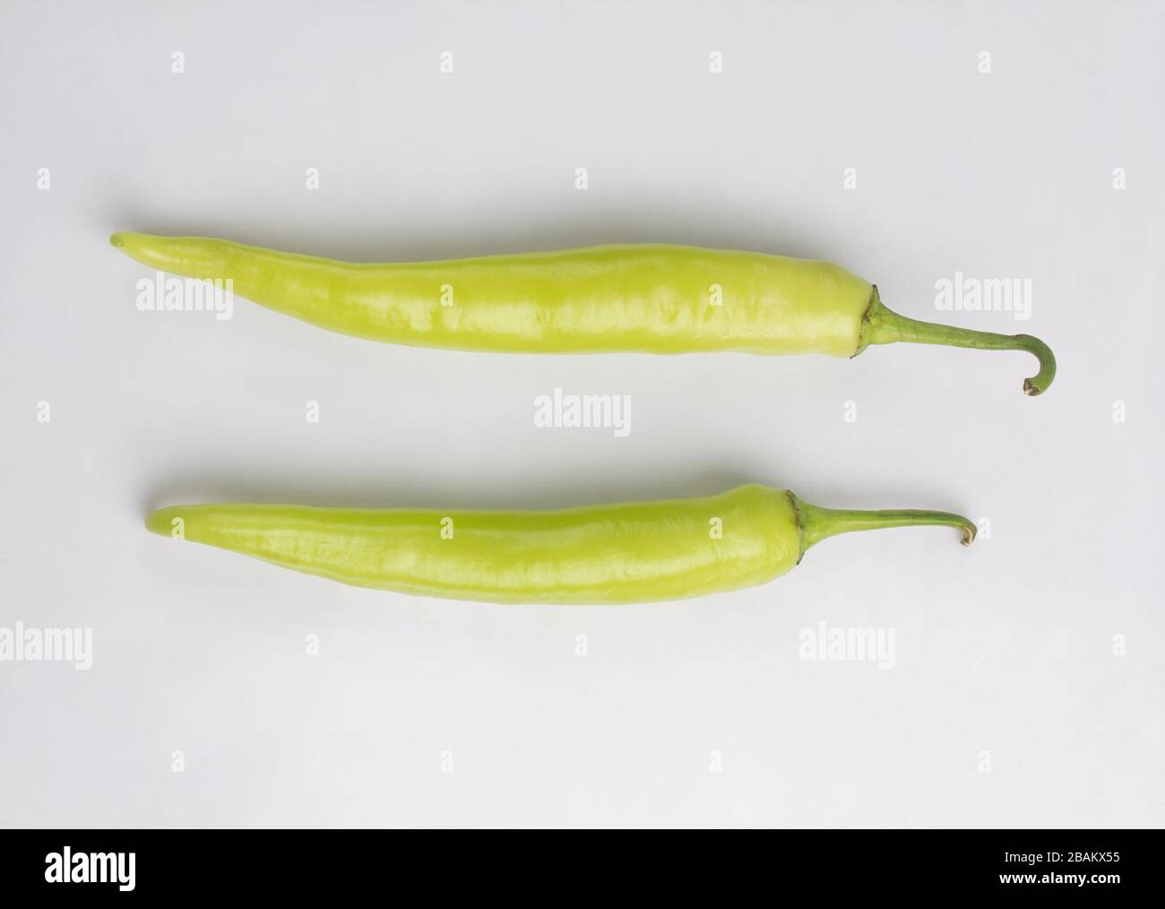 light green chili peppers isolated on white background Stock Photo - Alamy