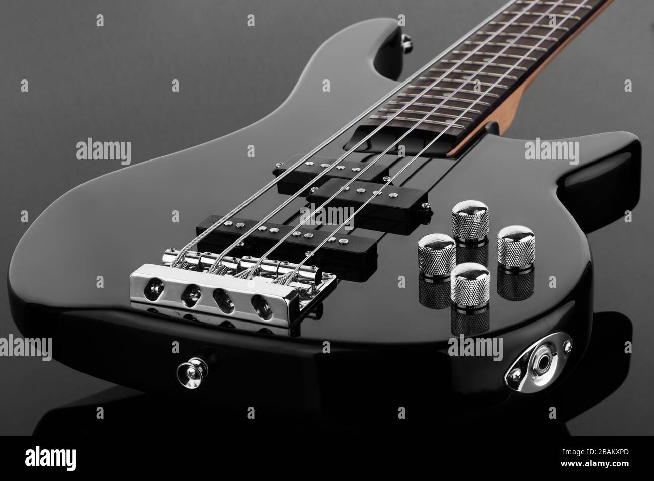 Body of black electric bass guitar on dark background Stock Photo - Alamy