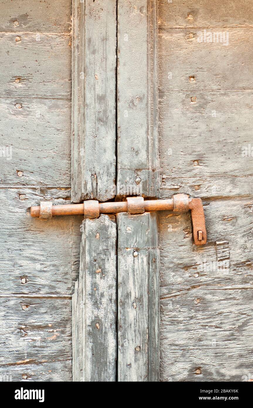Detail embossed metal handle and an old door Stock Photo - Alamy