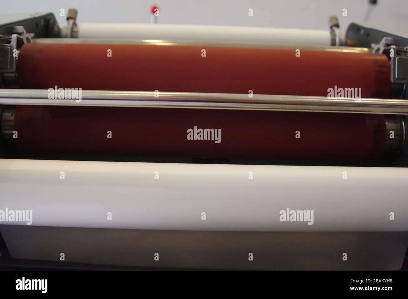 Plastic laminating machine Stock Photo - Alamy