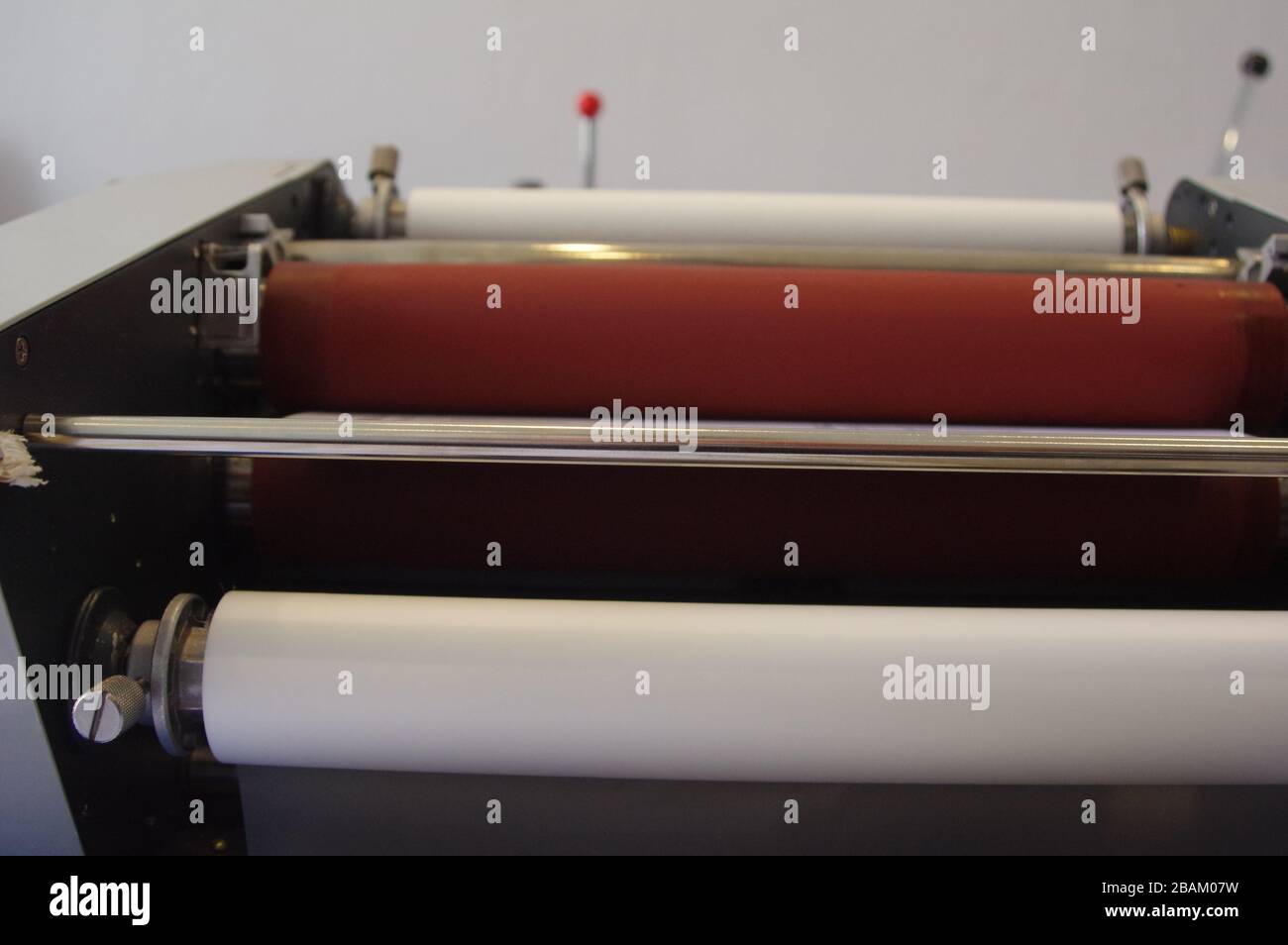 Plastic laminating machine Stock Photo - Alamy