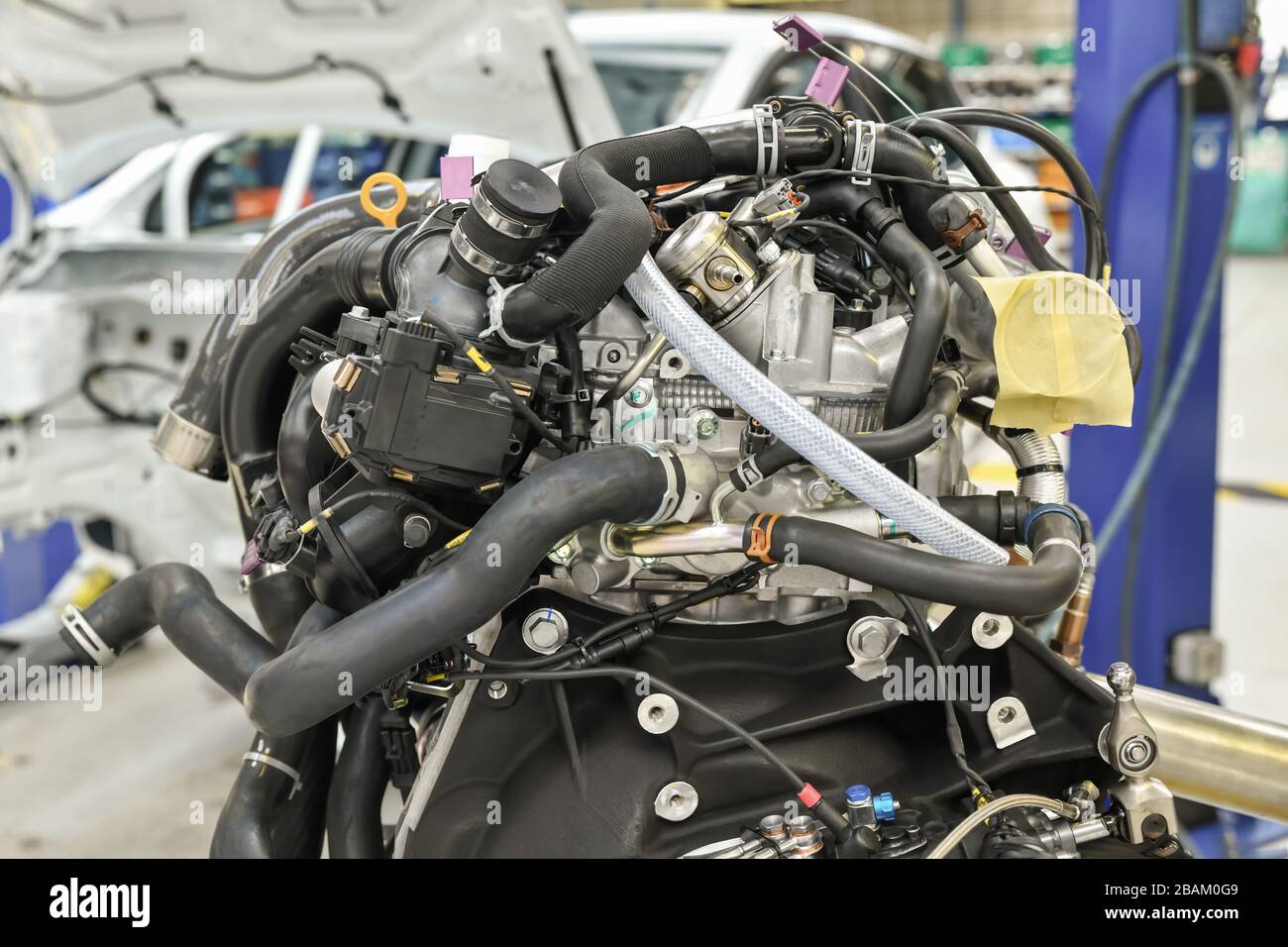 Details of a new car engine with motor sheath Stock Photo - Alamy