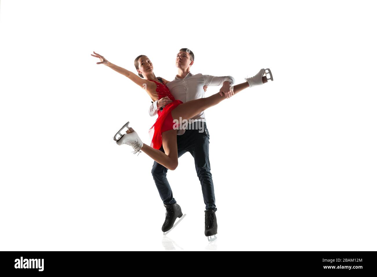 Duo figure skating isolated on white studio backgound with copyspace ...