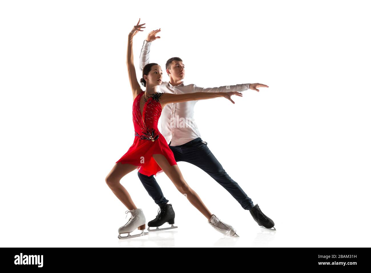Duo figure skating isolated on white studio backgound with copyspace ...