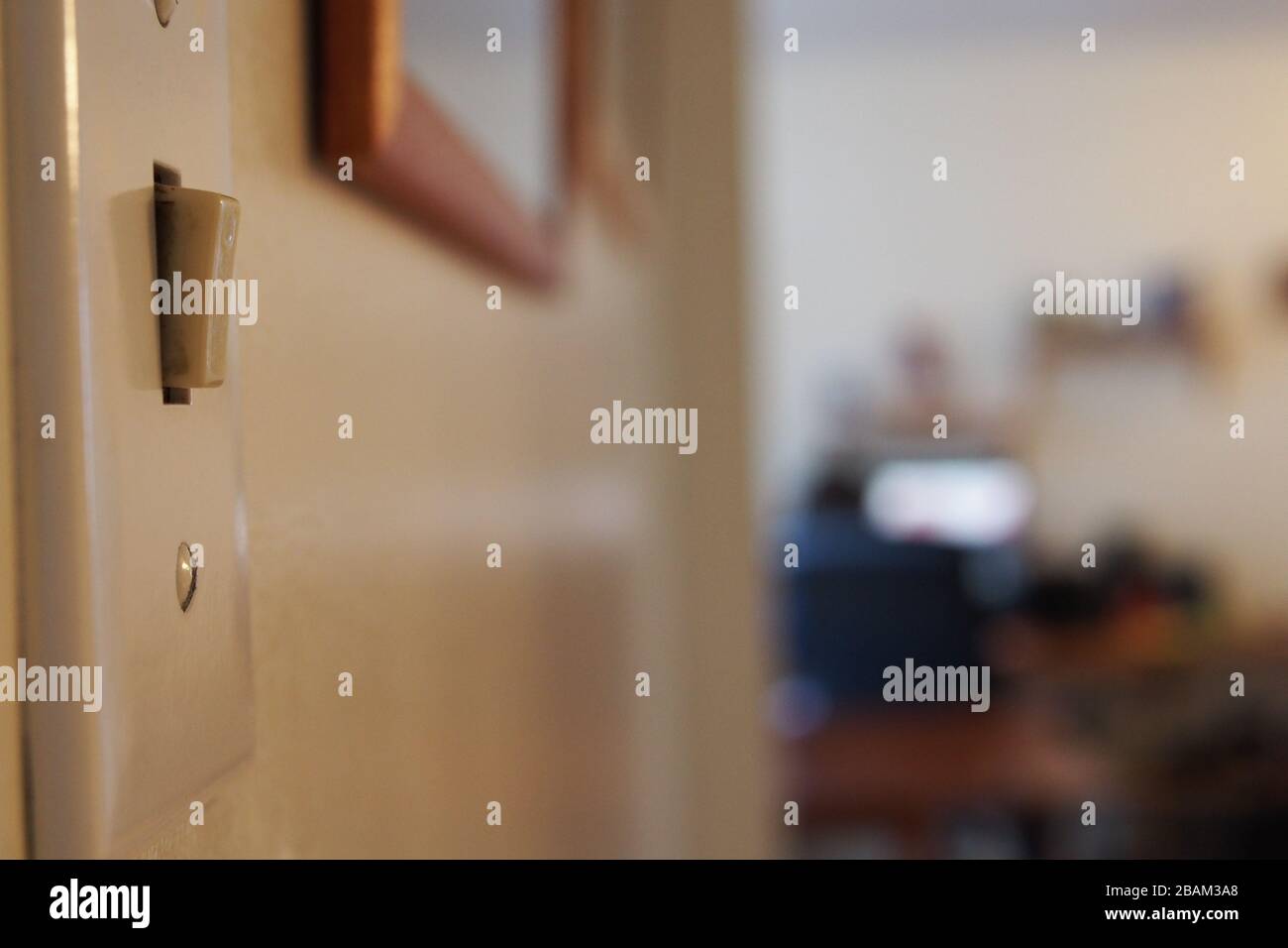 Close up of a light switch in my apartment hallway. Heavy bokeh with a ...