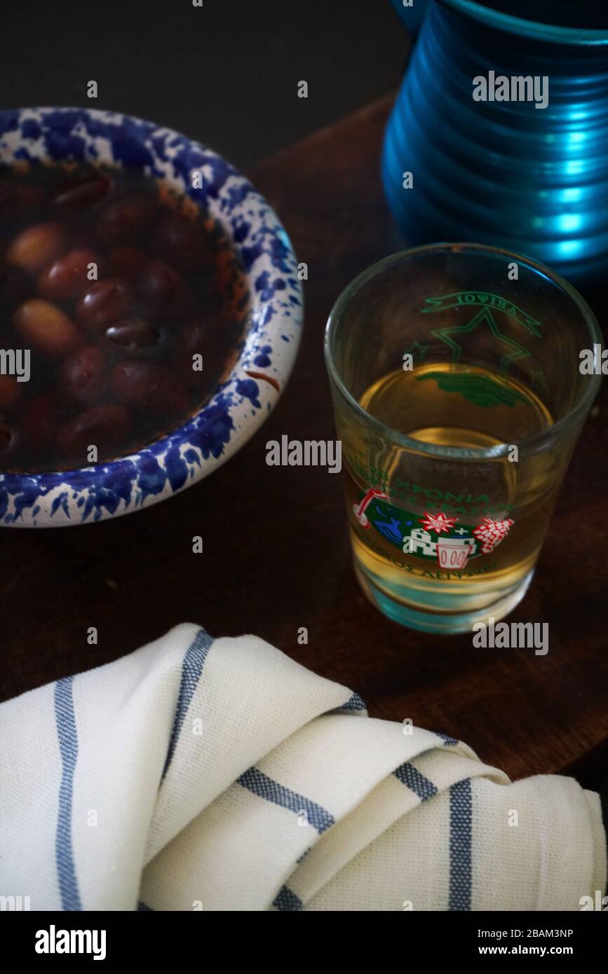Traditional kalamata olives served with white wine from the island of ...