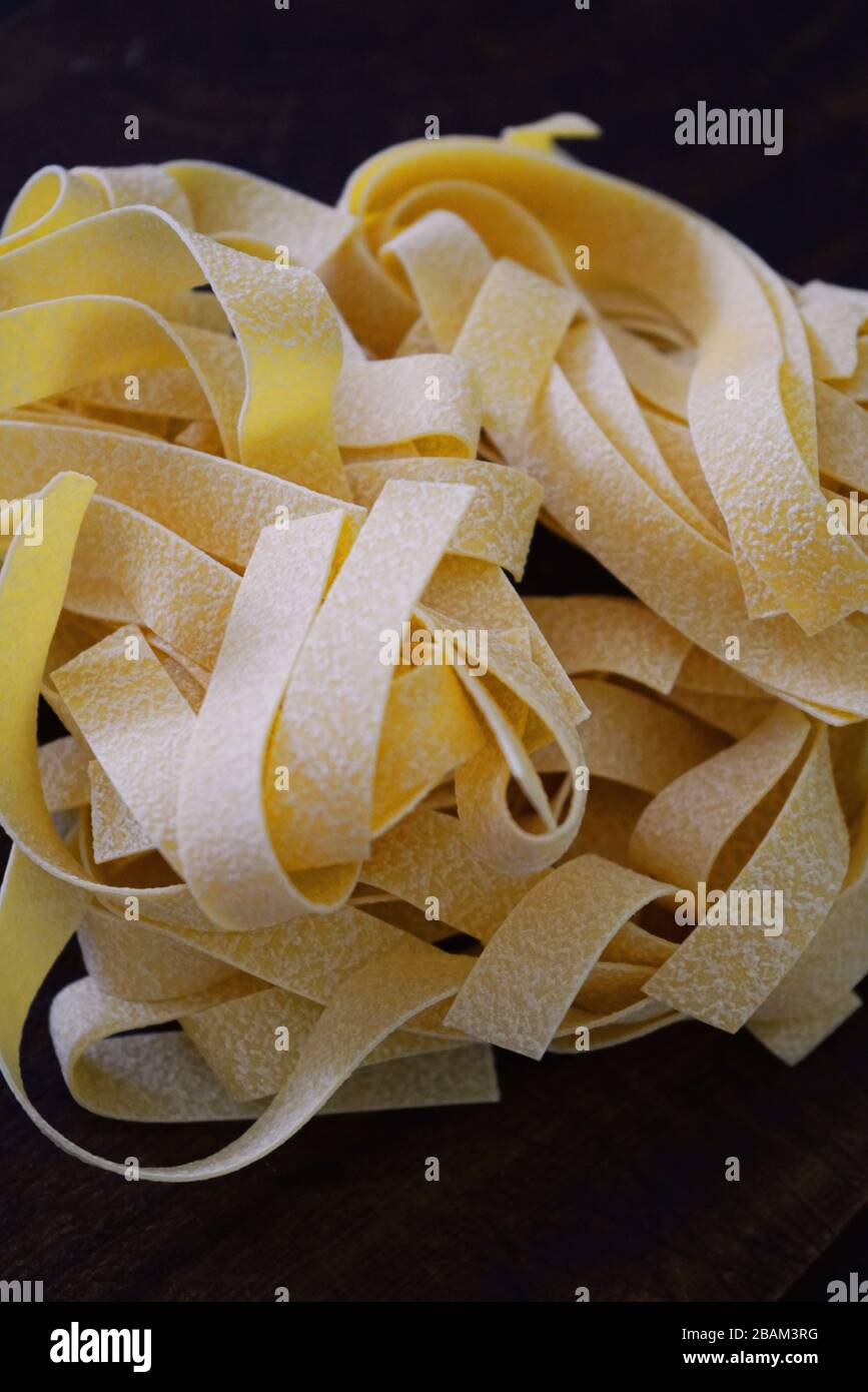Tagliatelle raw uncooked pasta Stock Photo - Alamy
