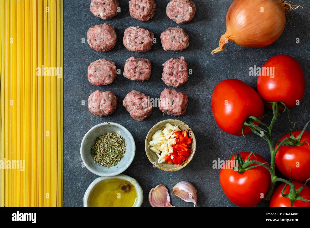 Flat lay with ingredients for pasta with meatballs Stock Photo - Alamy