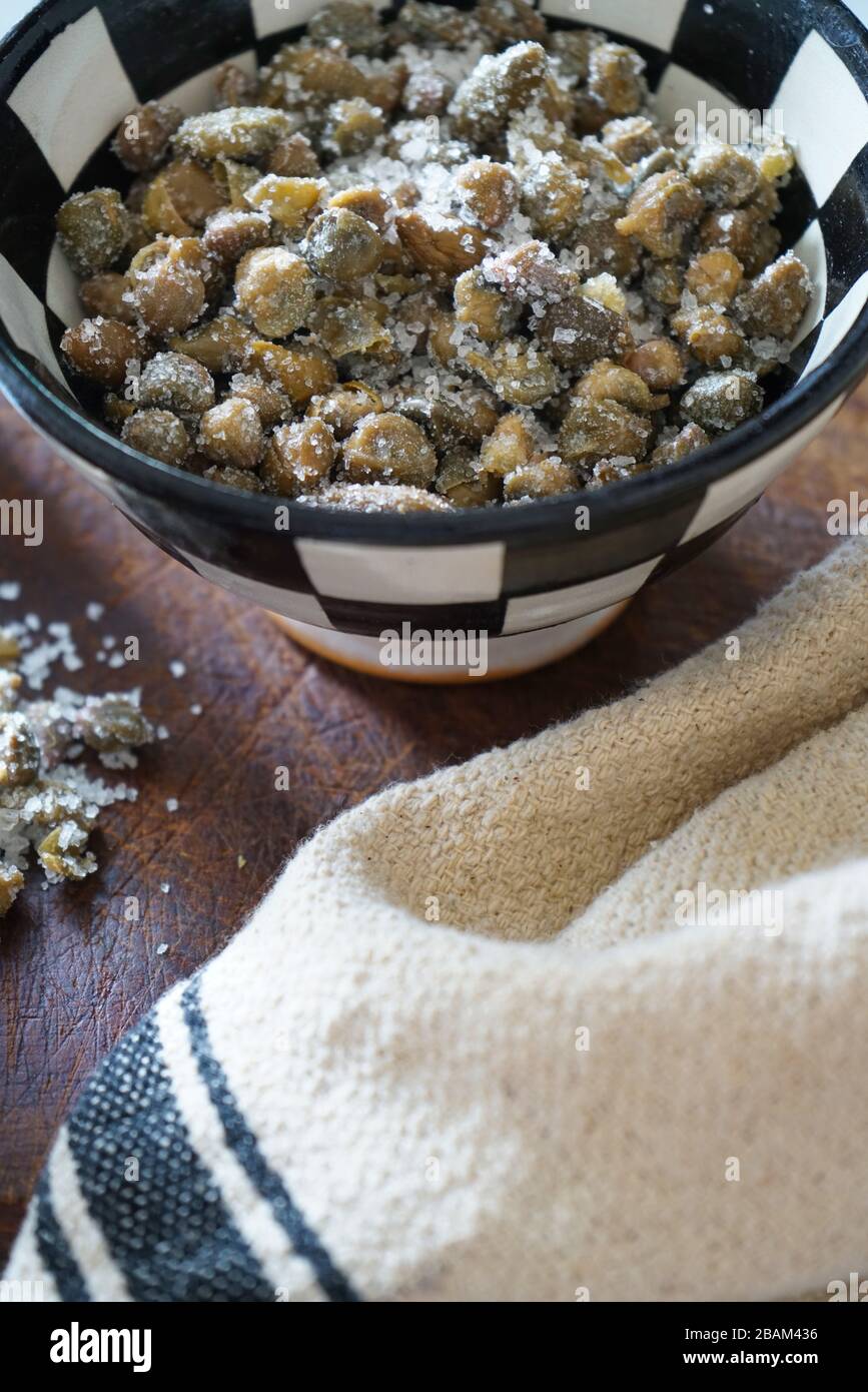 Traditional capers preserved under salt from the Pantelleria Island, I ...