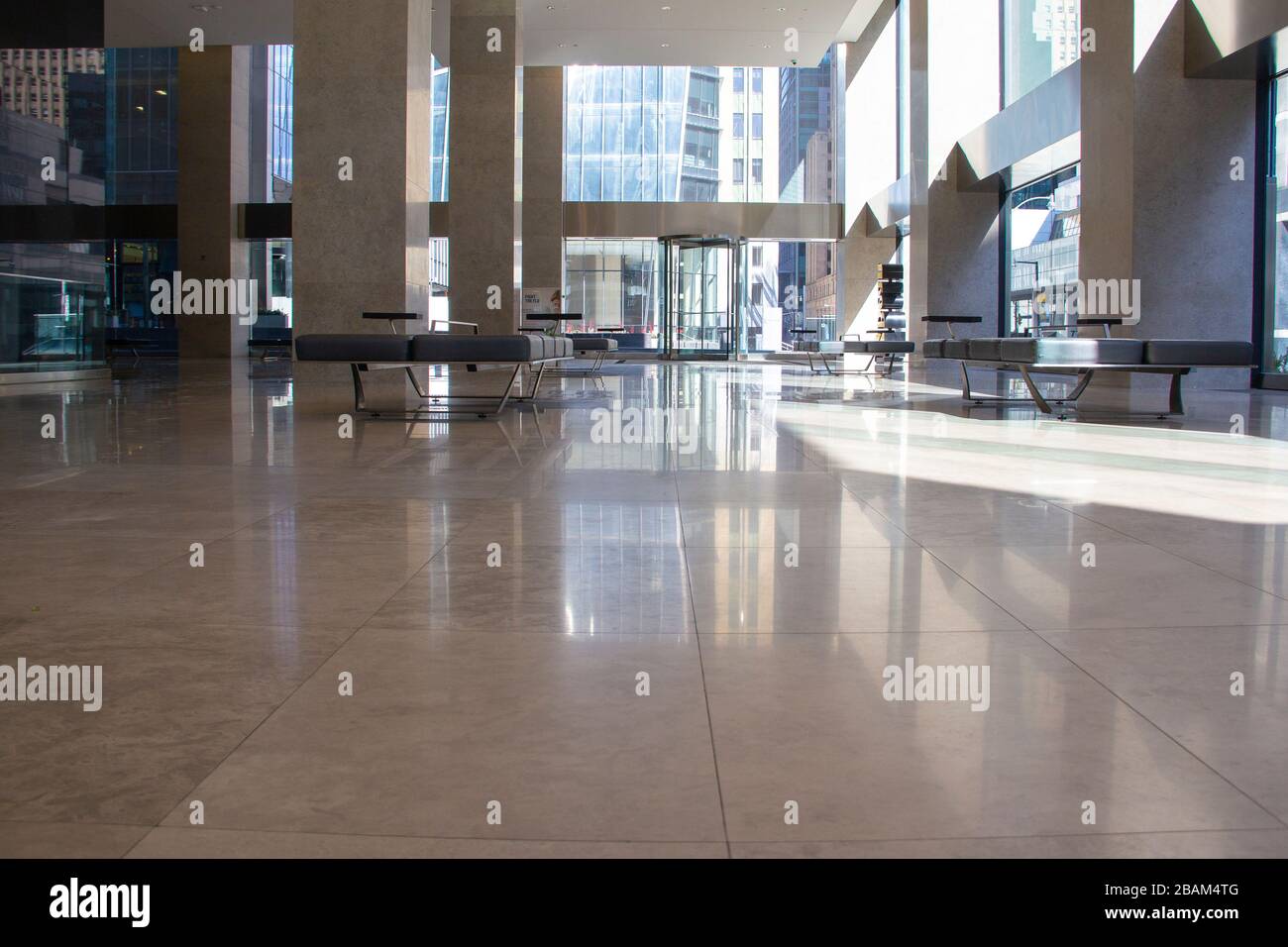 Sunlit empty office lobby Stock Photo - Alamy