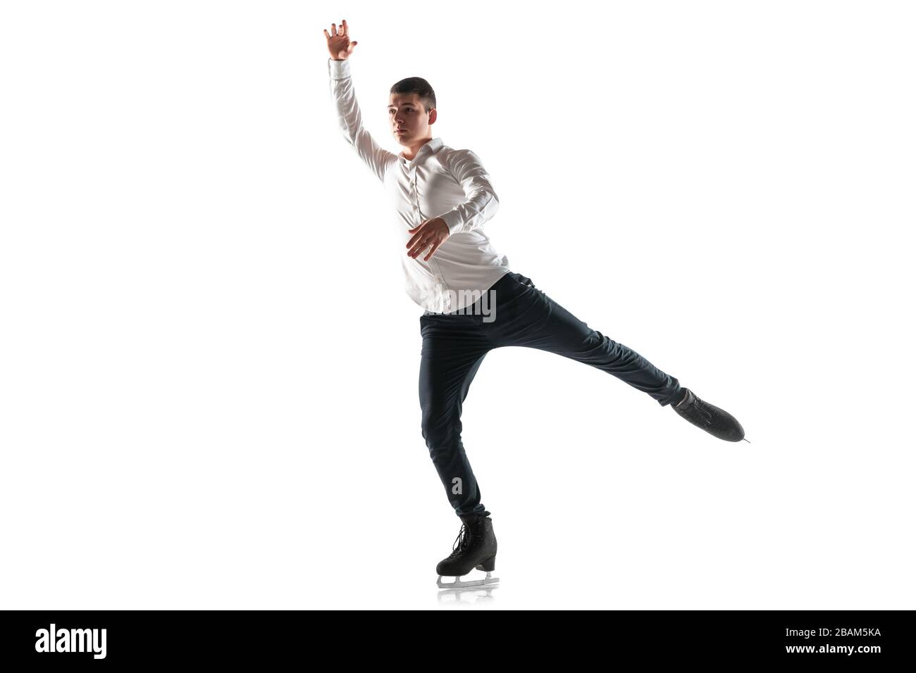 Man figure skating isolated on white studio backgound with copyspace ...