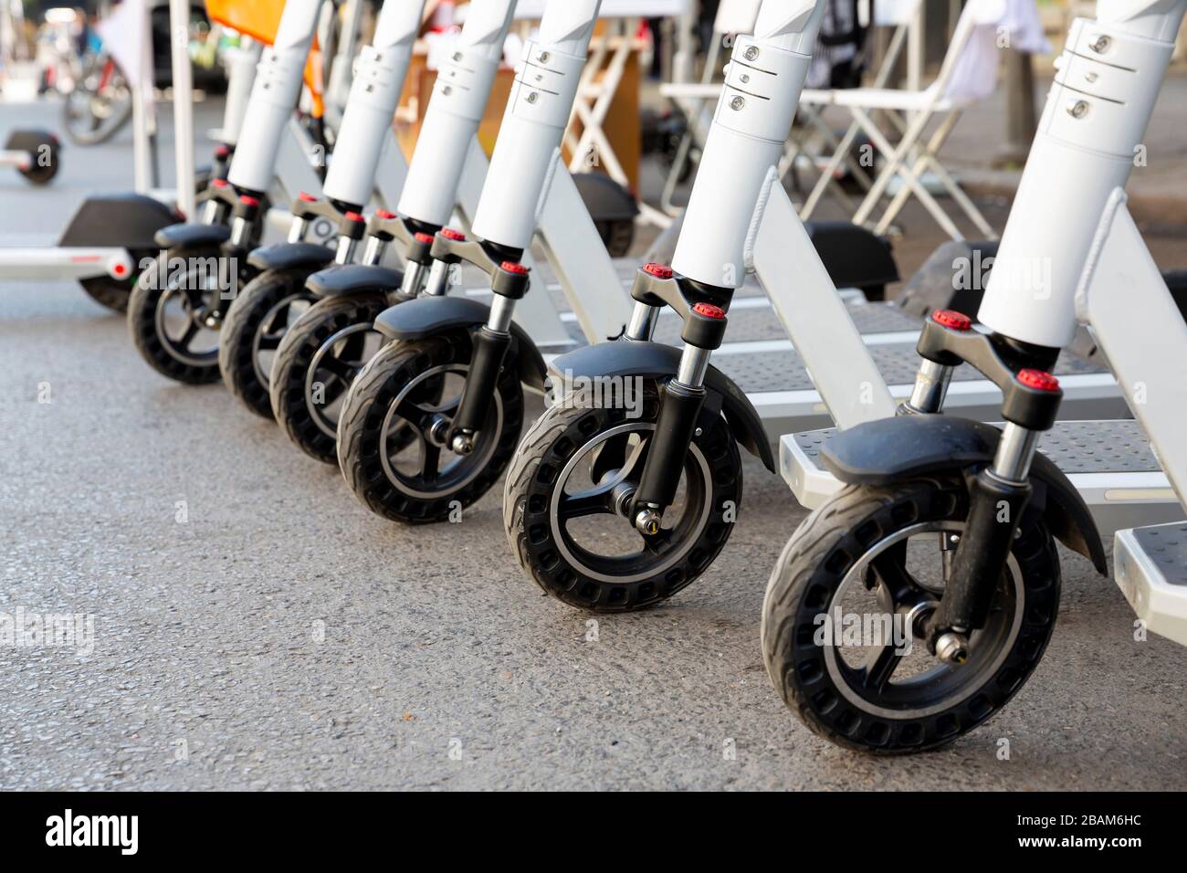 Electric scooters are seen arranged on a city street Stock Photo - Alamy