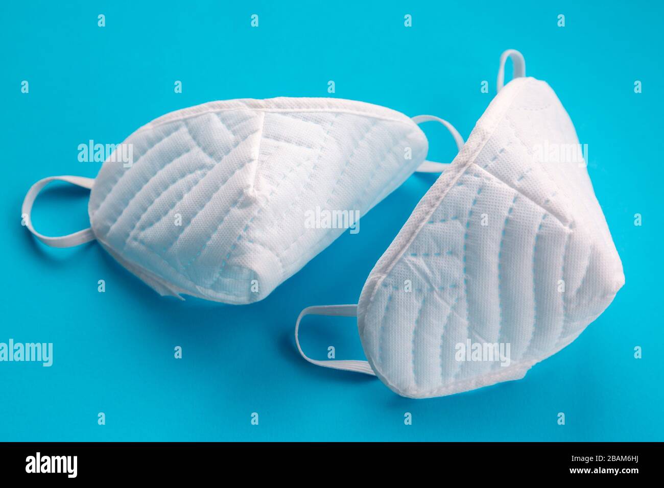 White protective masks on a blue background. Coronavirus (COVID-19 ...