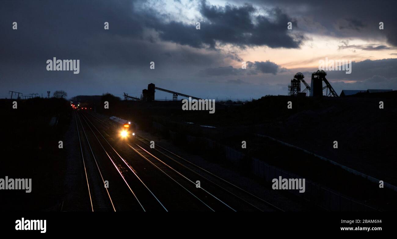Northern Rail class 170 Turbostar train passing the silhouette of the ...