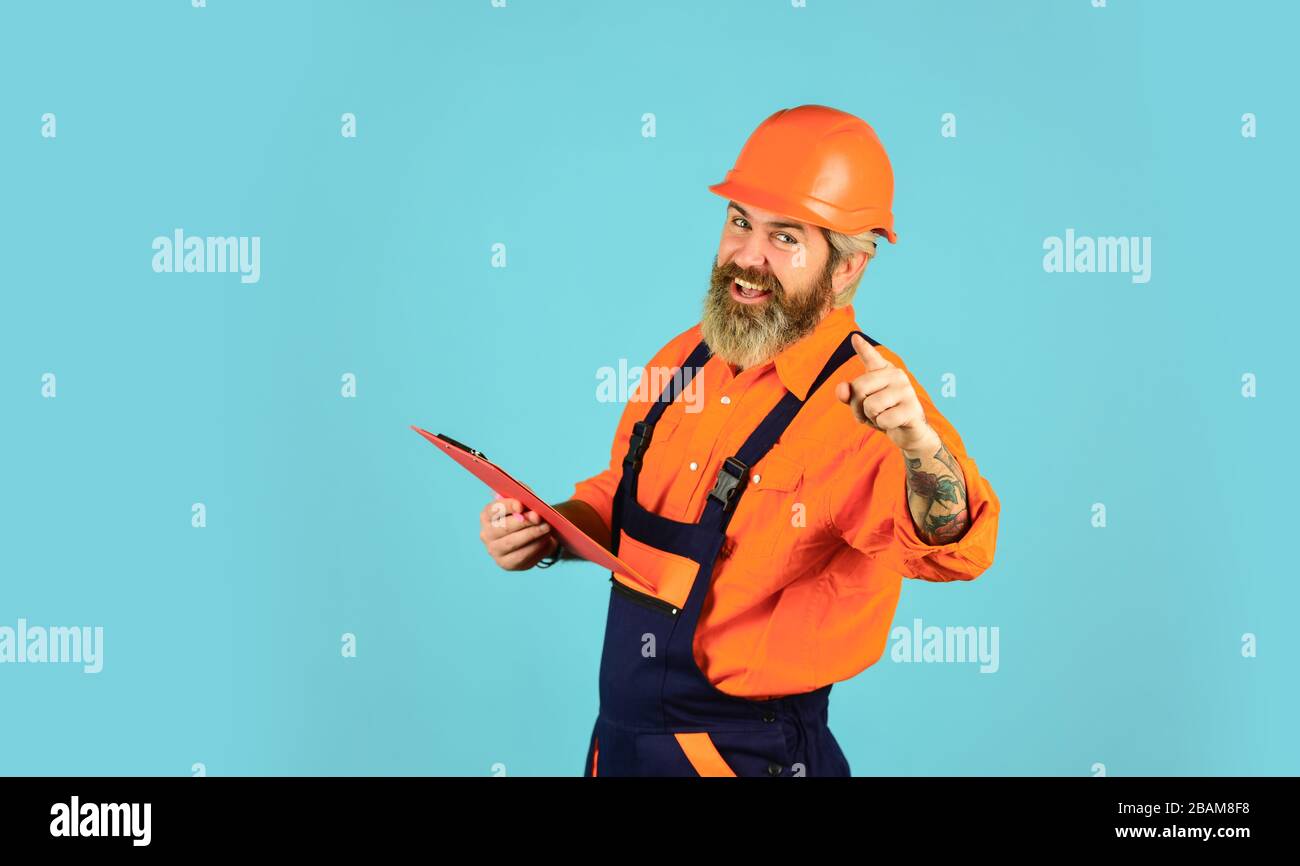 taking notes. industry and paperwork. Worker with happy face. Inspector ...