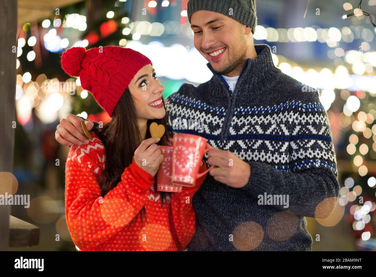 Young Couple Having Fun Outdoors At Christmas Time Stock Photo - Alamy