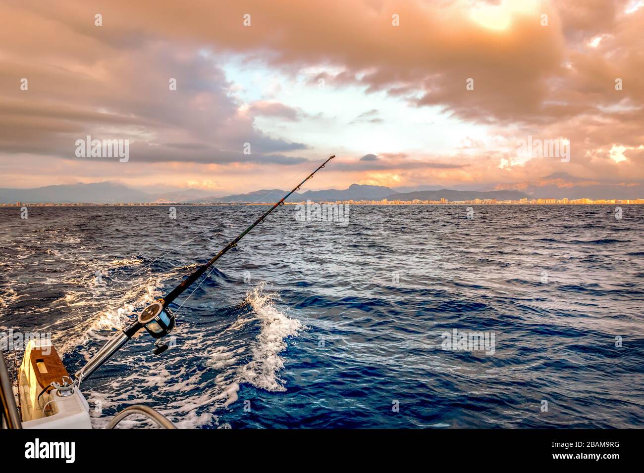 Rod with the coil fixed onboard the vessel Stock Photo - Alamy
