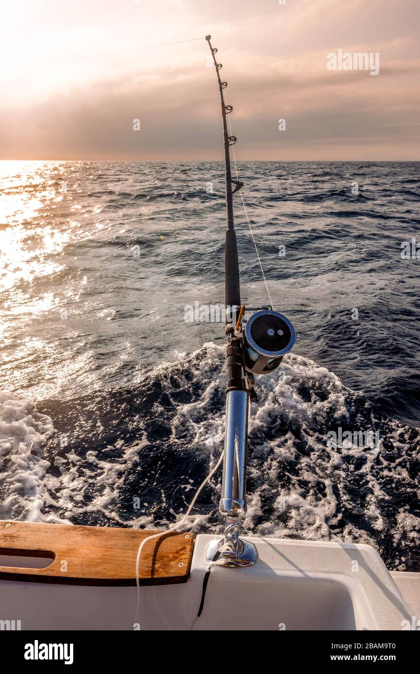Rod with the coil fixed onboard the vessel Stock Photo - Alamy