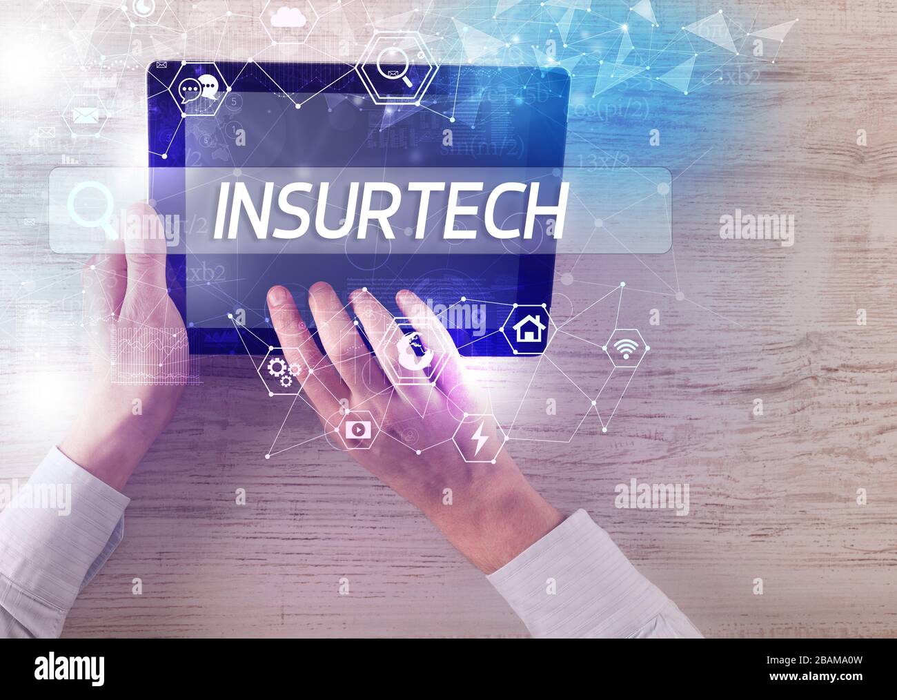 Close-up of a tablet searching INSURTECH inscription, hi-tech computing ...