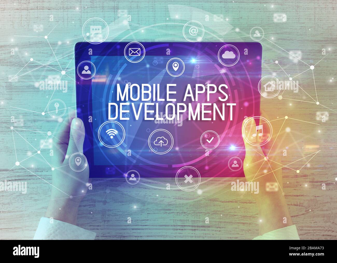 Close-up of a tablet with MOBILE APPS DEVELOPMENT inscription ...