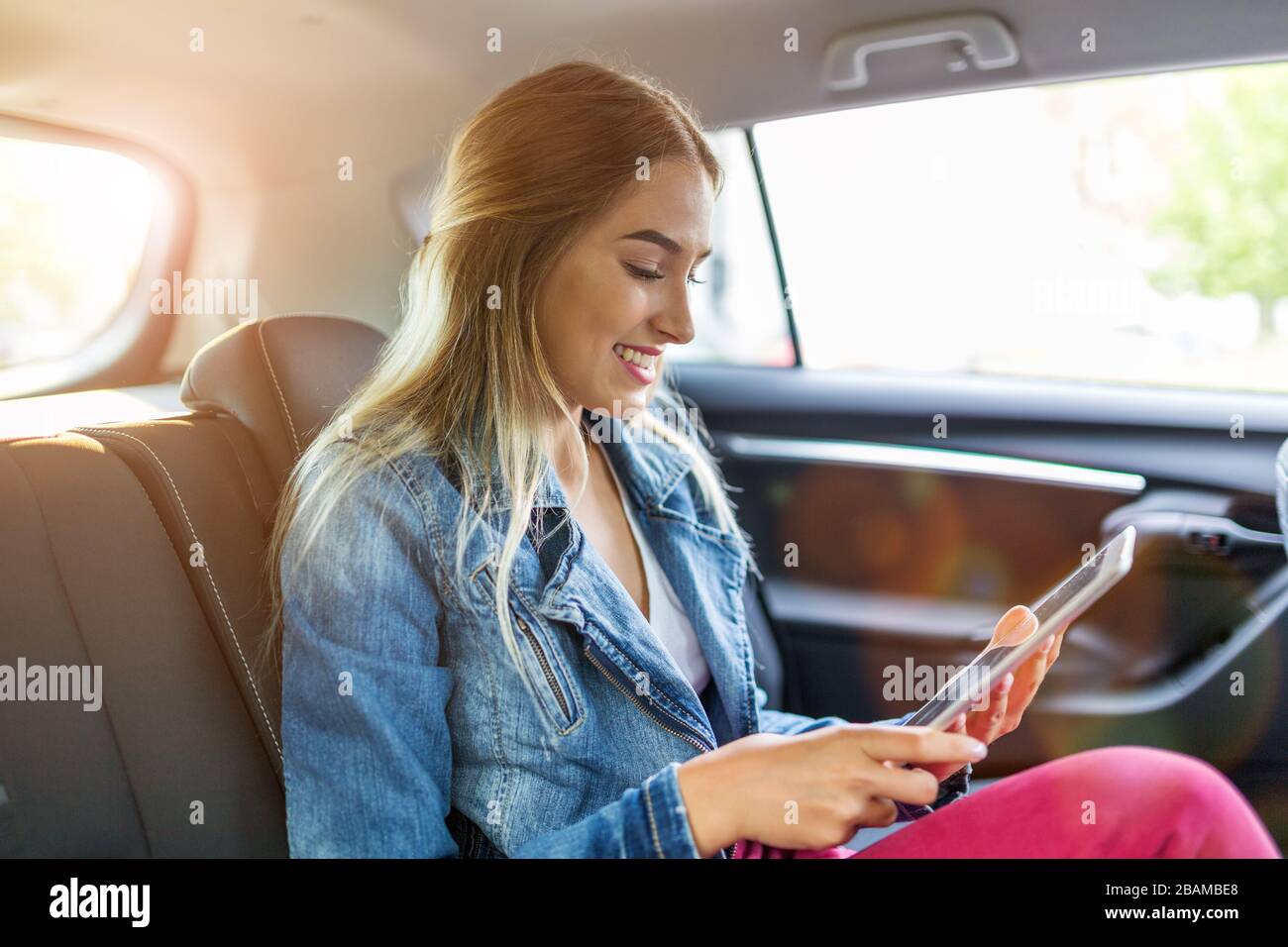 Young Woman In A Taxi Stock Photo - Alamy