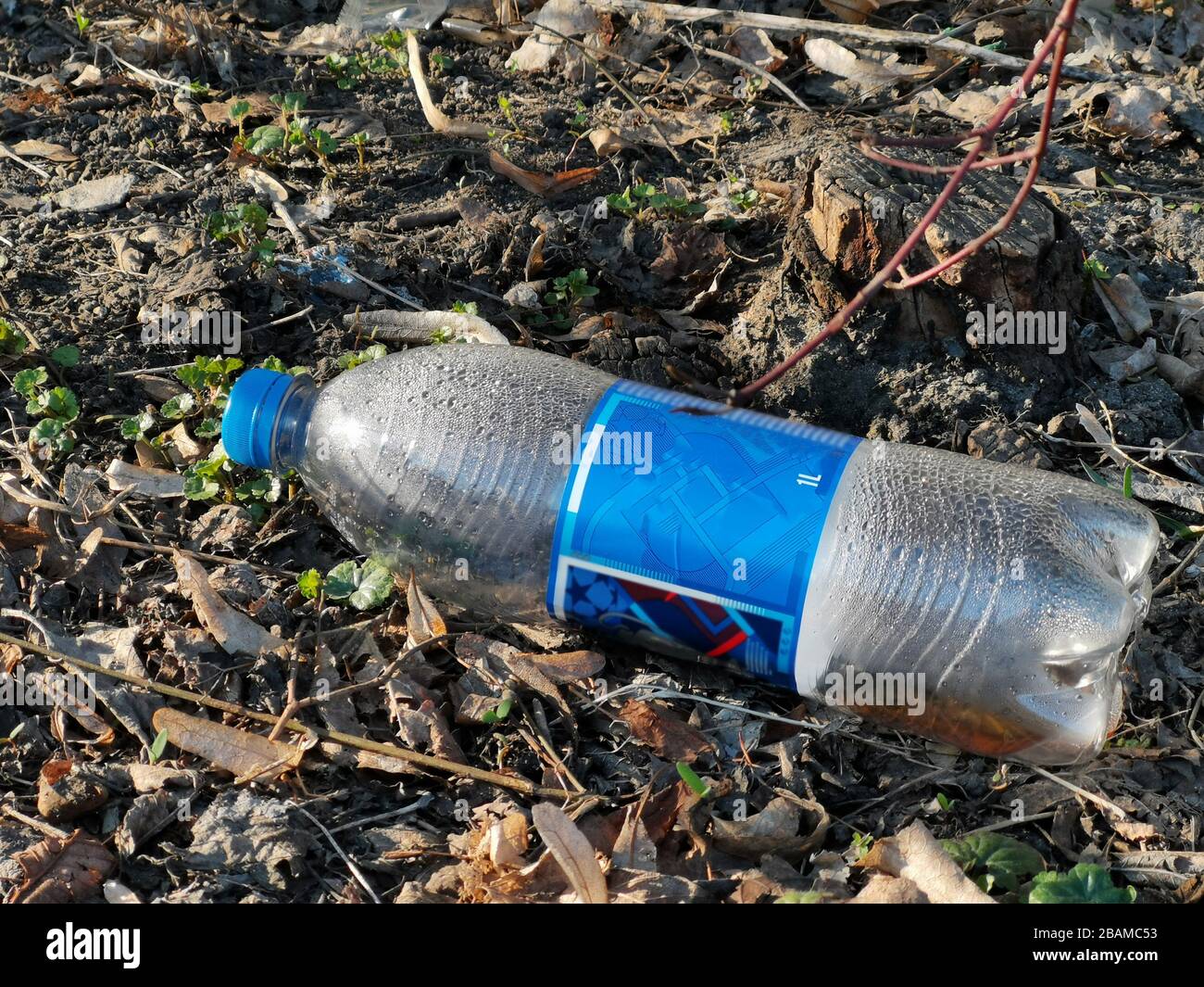 Empty plastic soda bottle on the groud Stock Photo - Alamy
