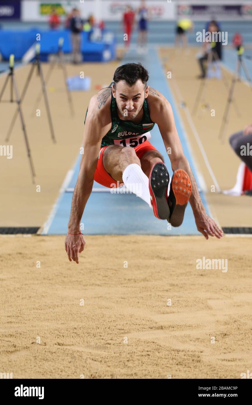 ISTANBUL, TURKEY - FEBRUARY 15, 2020: Undefined athlete long jumping ...
