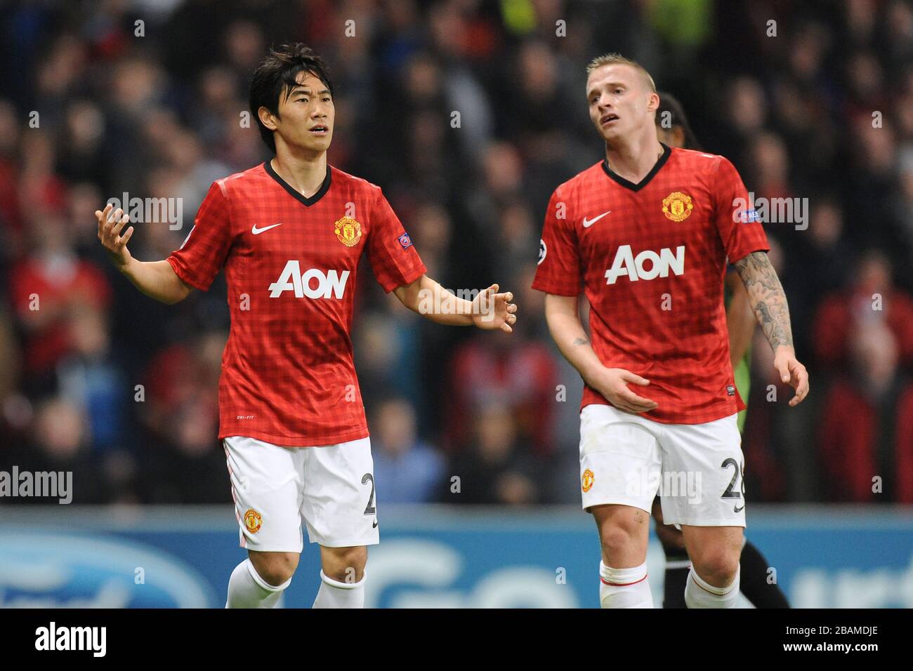 Manchester United's Shinji Kagawa (left) and Alexander Buttner stand ...