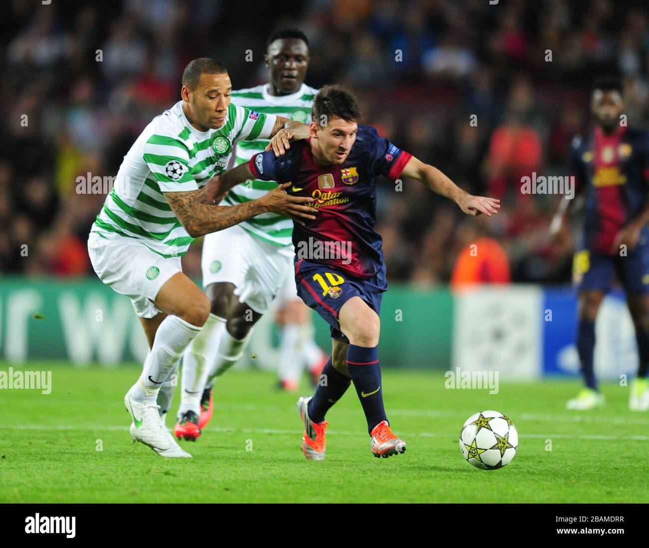Barcelona's Lionel Messi (right) and Celtic's Kelvin Wilson battle for ...