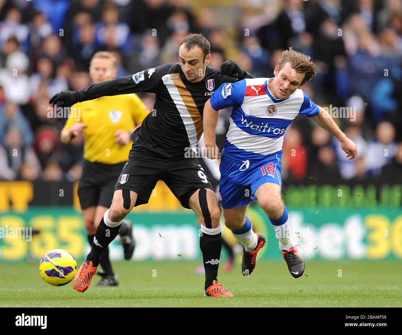 Fulham's Dimitar Berbatov (left) and Reading's Jay Tabb (right) battle ...