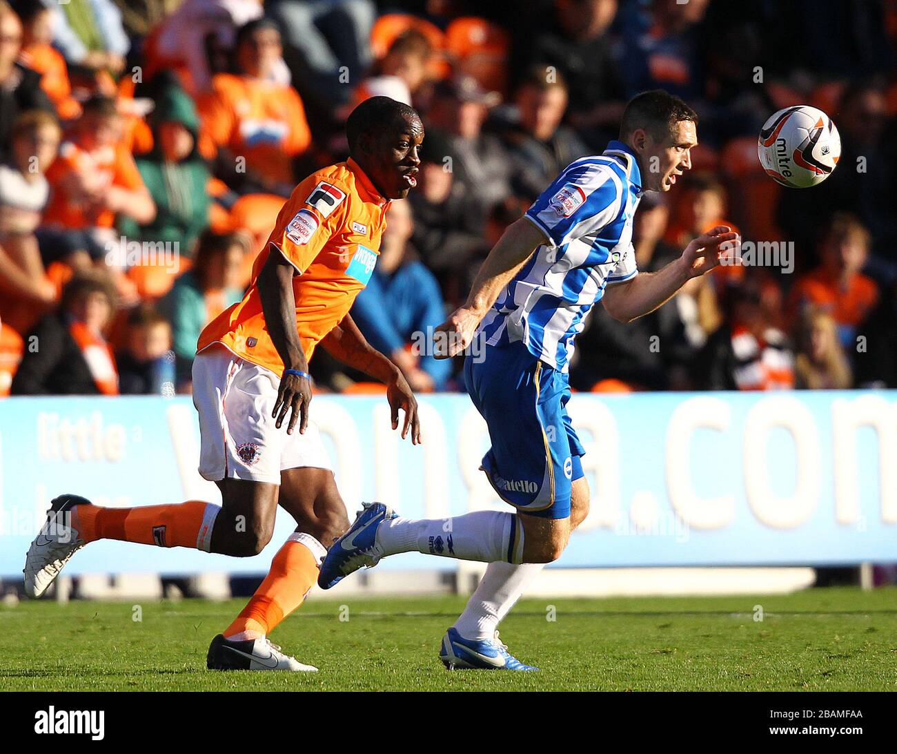 Blackpool's Isaiah Osbourne (left) and Brighton & Hove Albion's Andrew Croft (right) in action ...