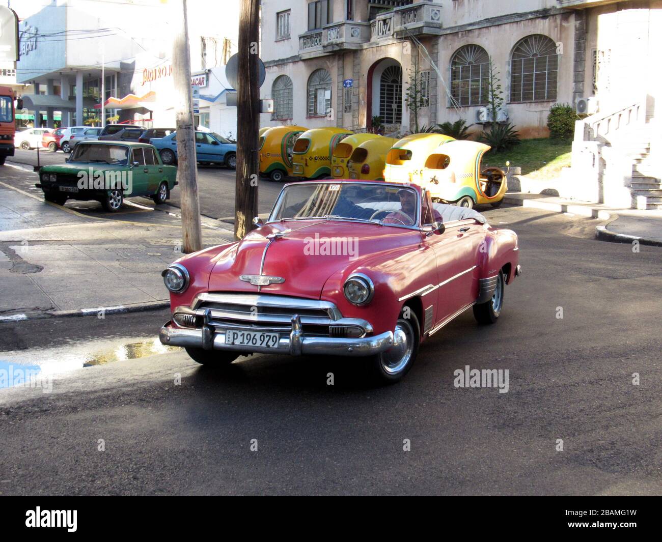 American convertible vintage cars parked on the main street in Cuba ...