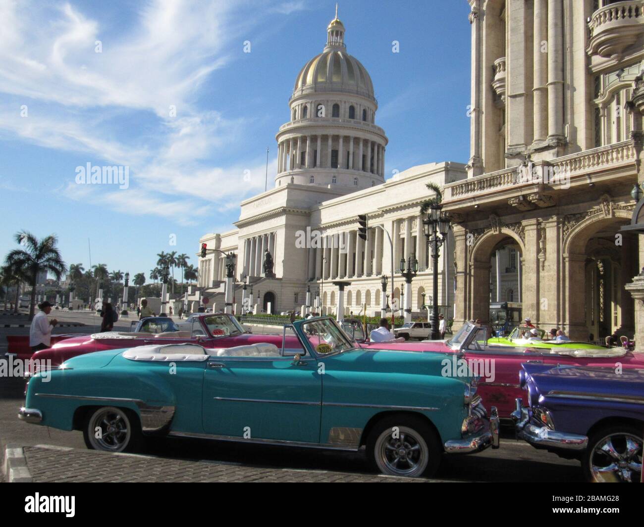 American convertible vintage cars parked on the main street in Cuba ...