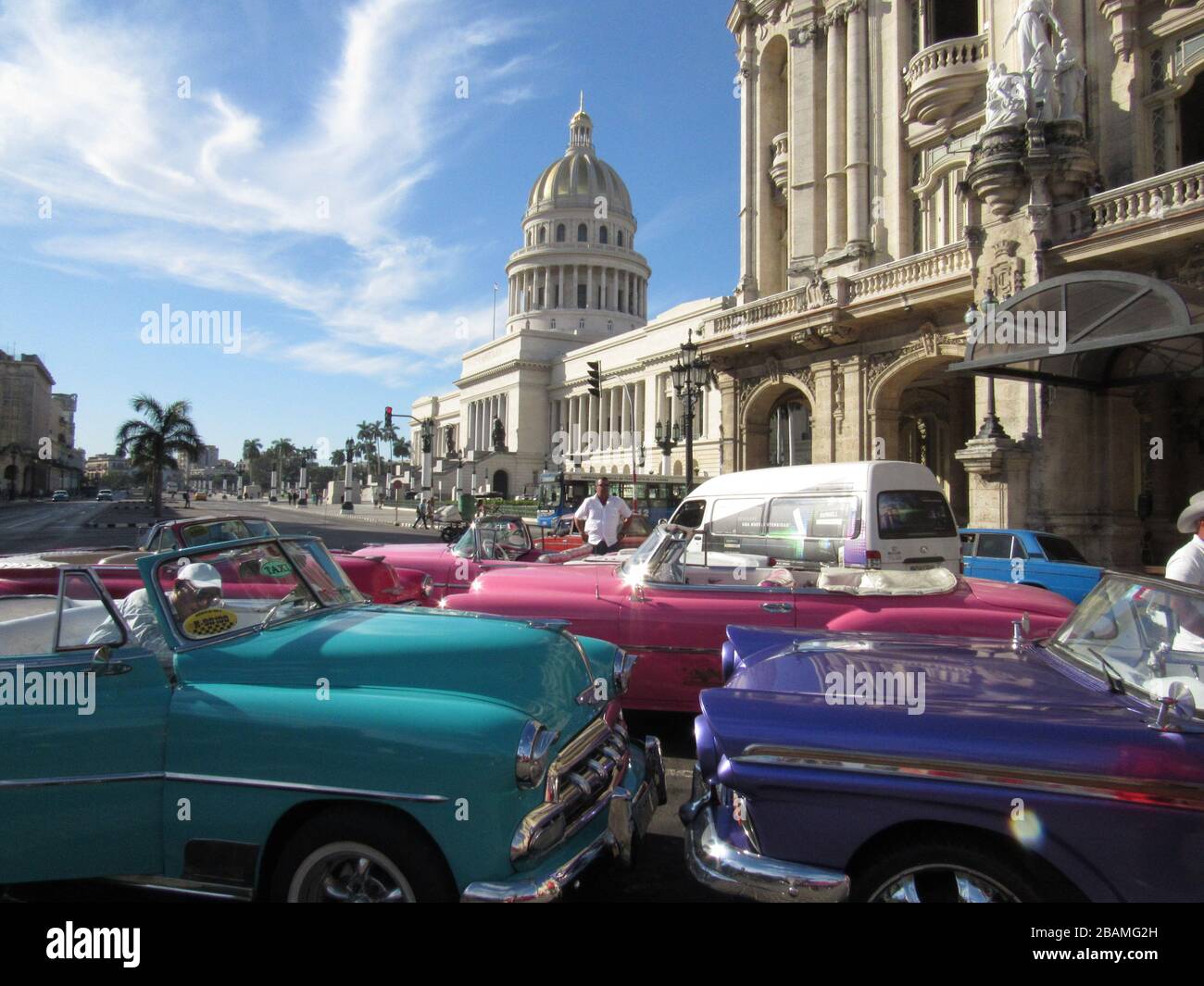 American convertible vintage cars parked on the main street in Cuba ...