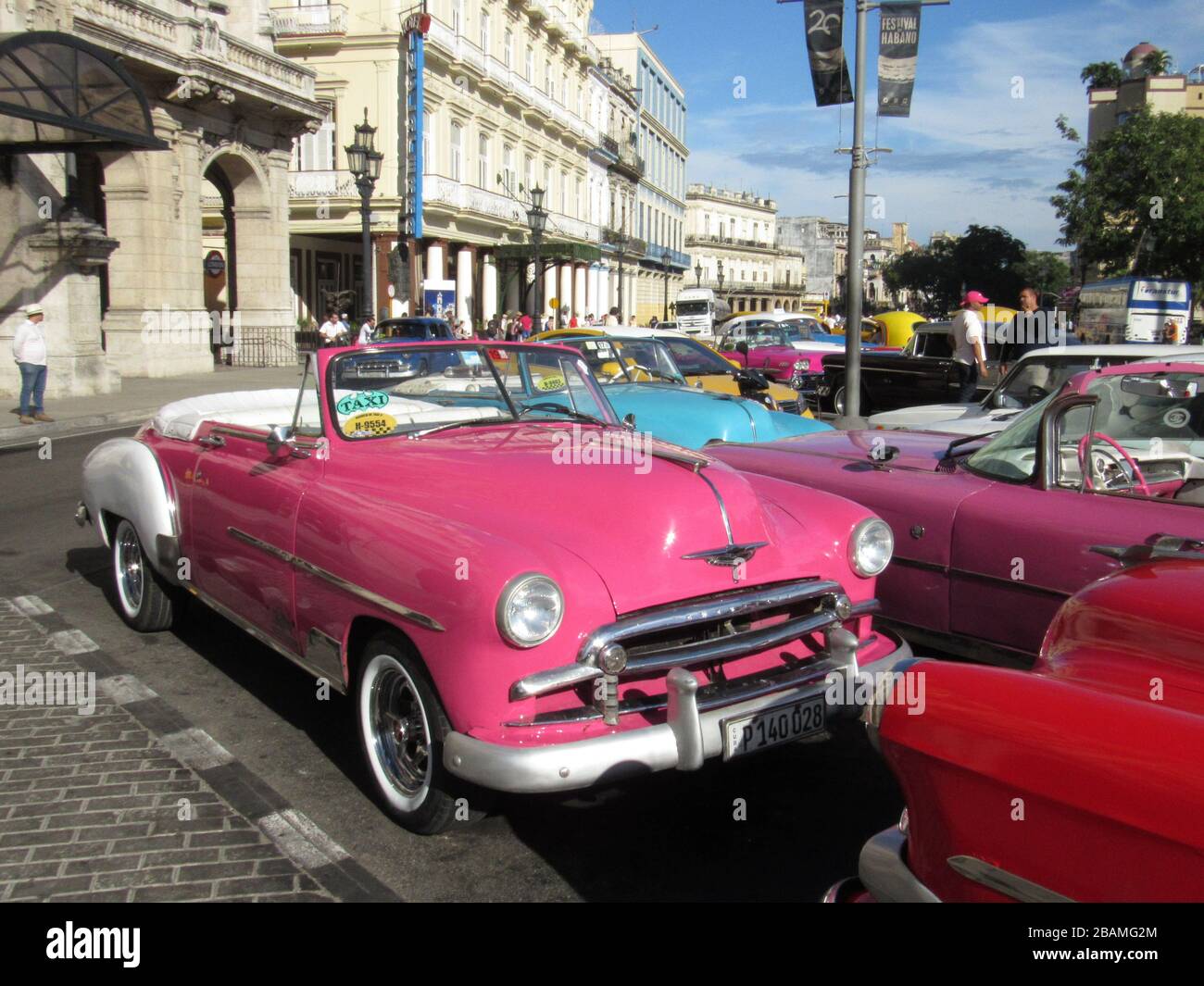 American convertible vintage cars parked on the main street in Cuba ...
