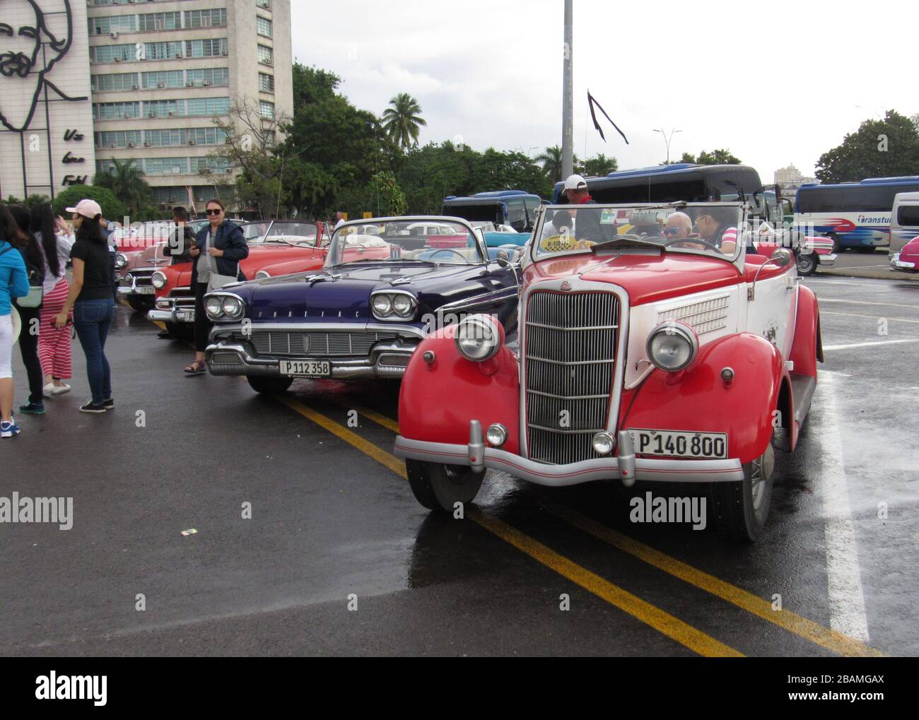 American convertible vintage cars parked on the main street in Cuba ...