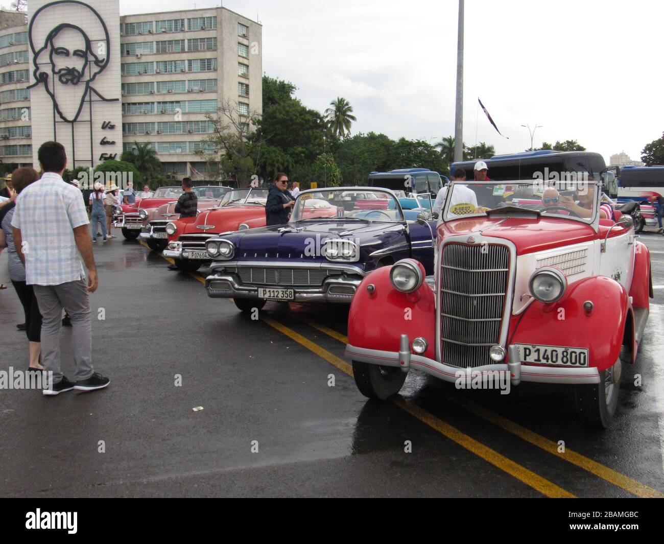 American convertible vintage cars parked on the main street in Cuba ...