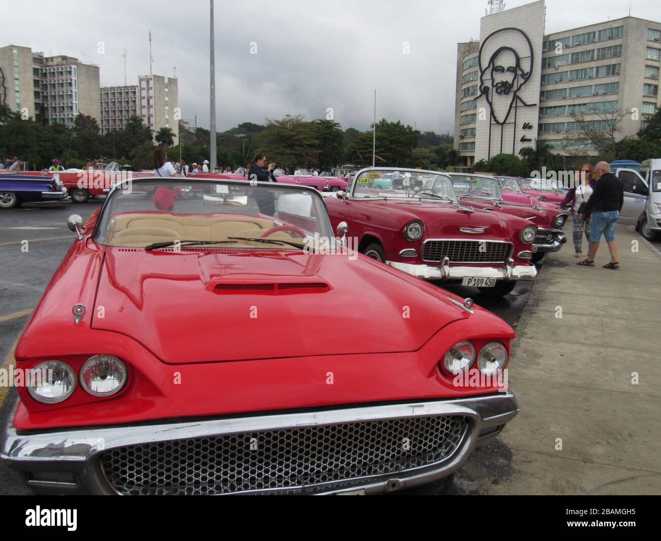 American convertible vintage cars parked on the main street in Cuba ...