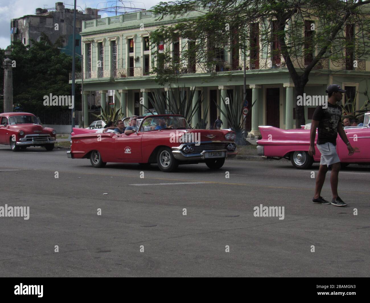 American convertible vintage cars parked on the main street in Cuba ...