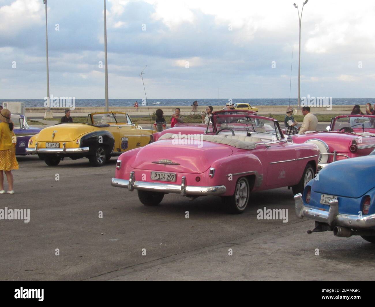American convertible vintage cars parked on the main street in Cuba ...