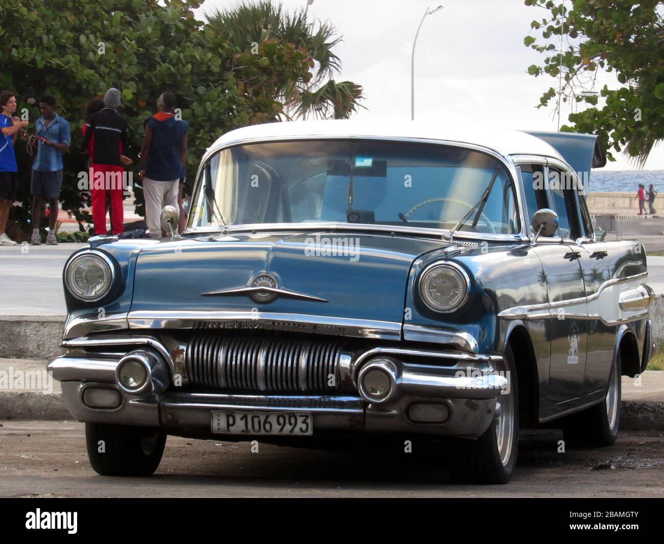 American convertible vintage cars parked on the main street in Cuba ...