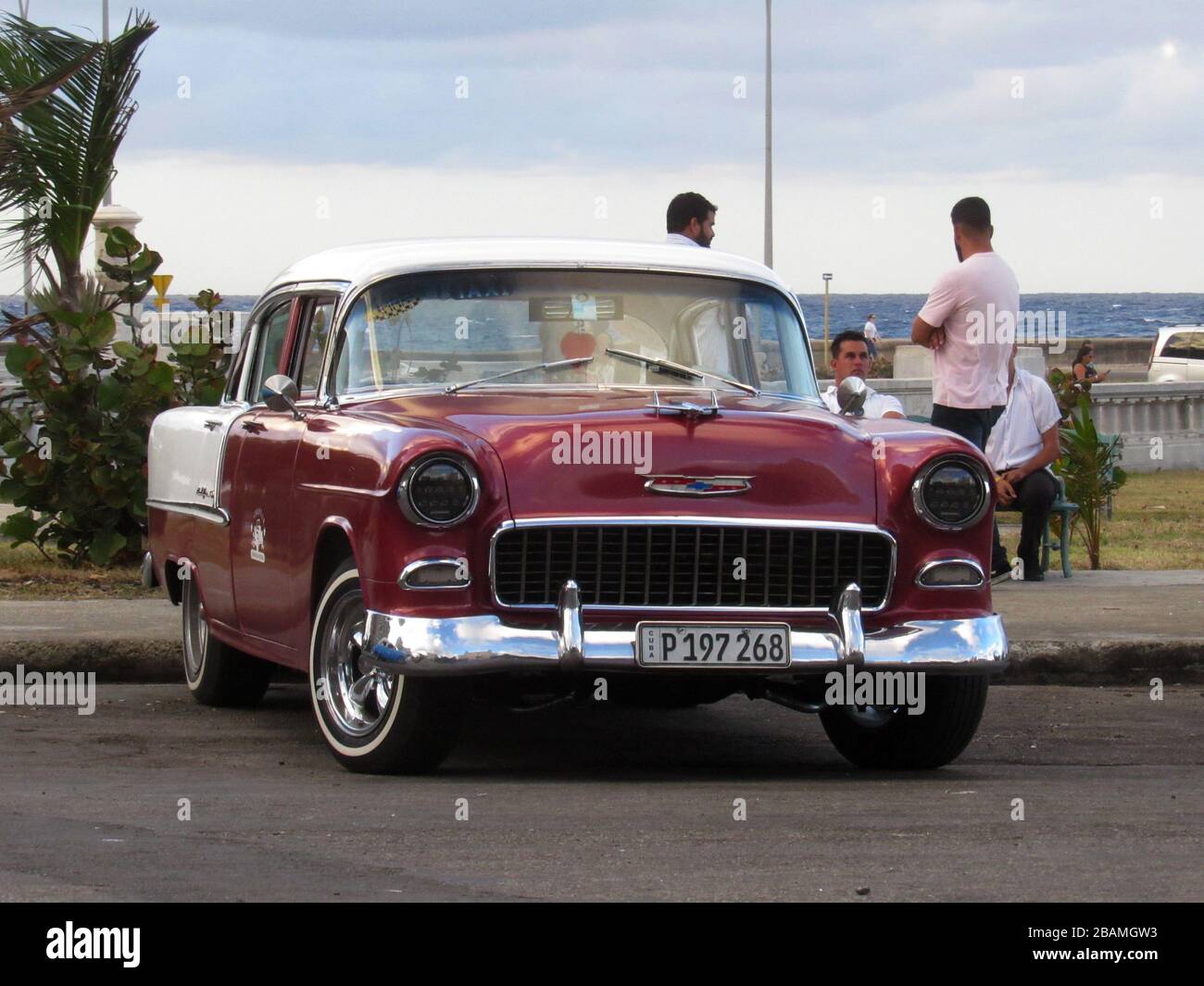 American convertible vintage cars parked on the main street in Cuba ...