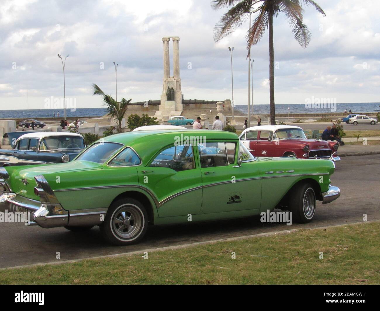 American convertible vintage cars parked on the main street in Cuba ...