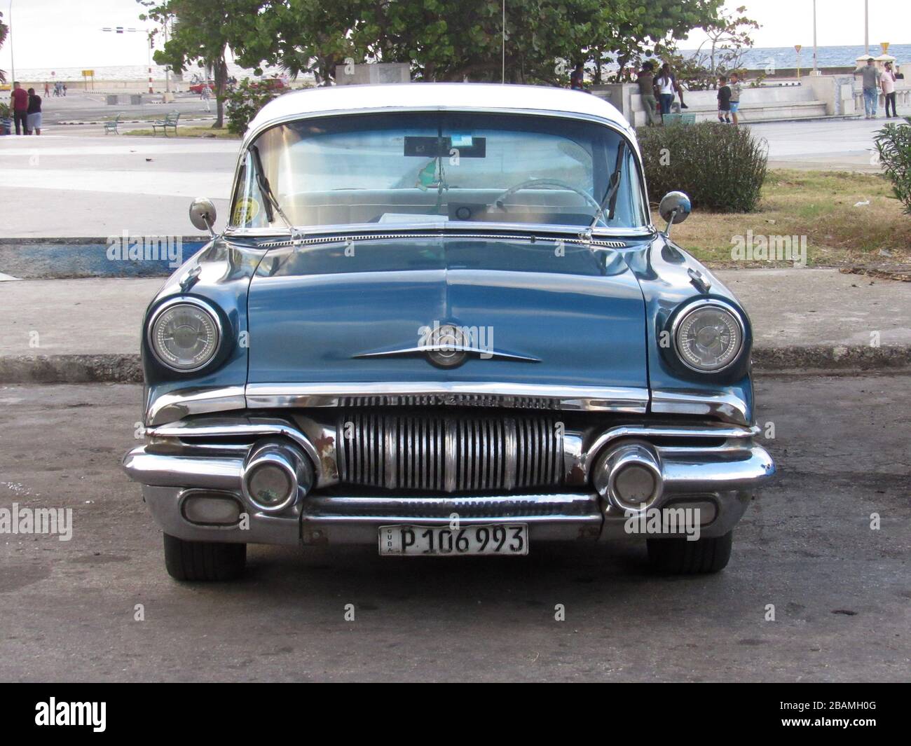 American convertible vintage cars parked on the main street in Cuba ...