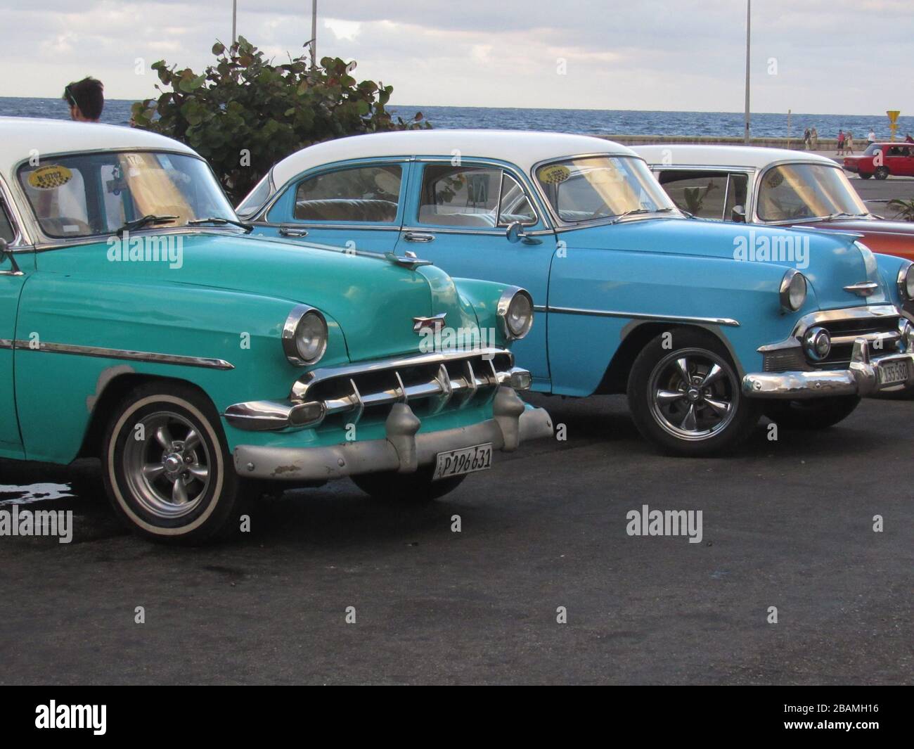 American convertible vintage cars parked on the main street in Cuba ...