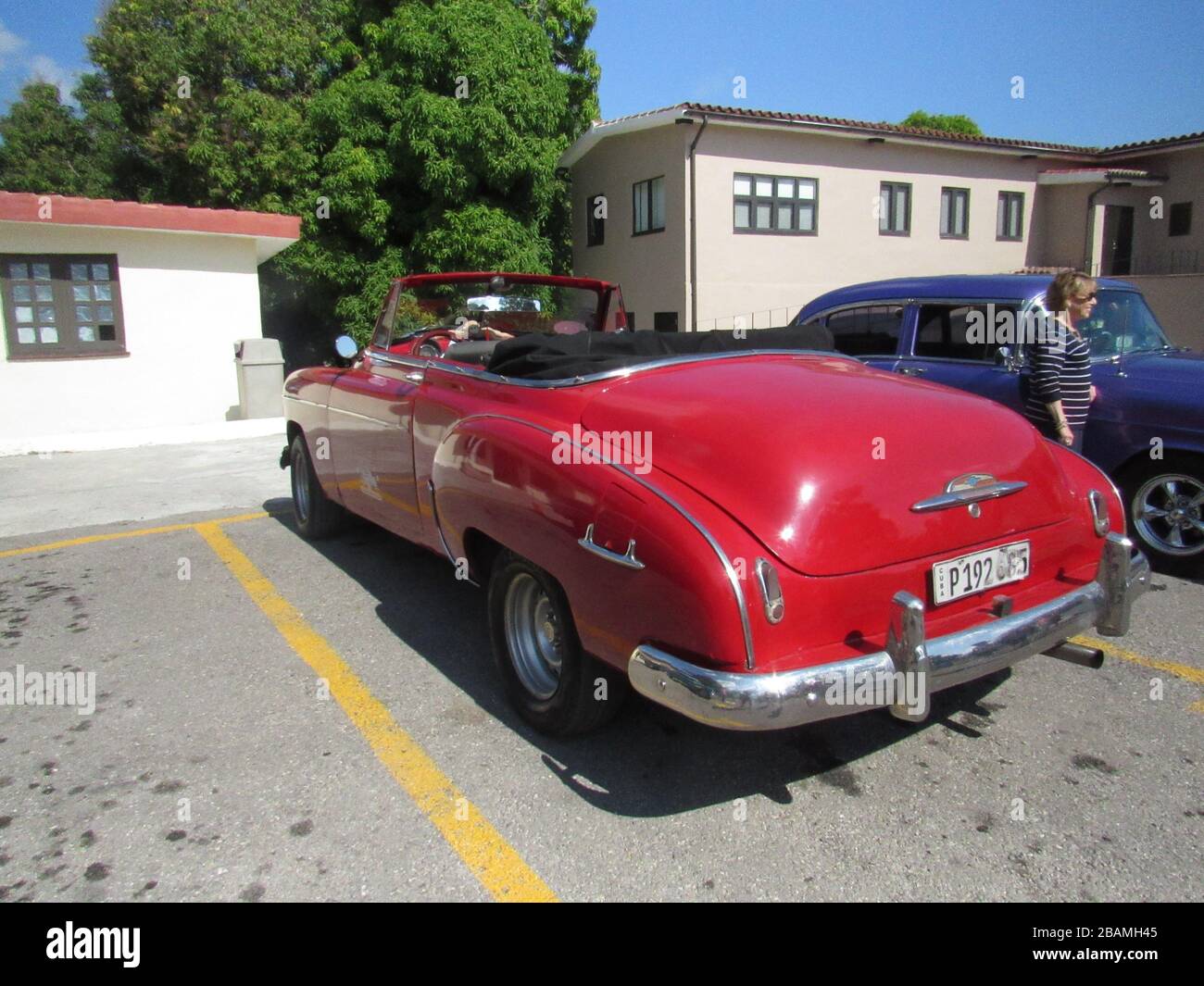 American convertible vintage cars parked on the main street in Cuba ...